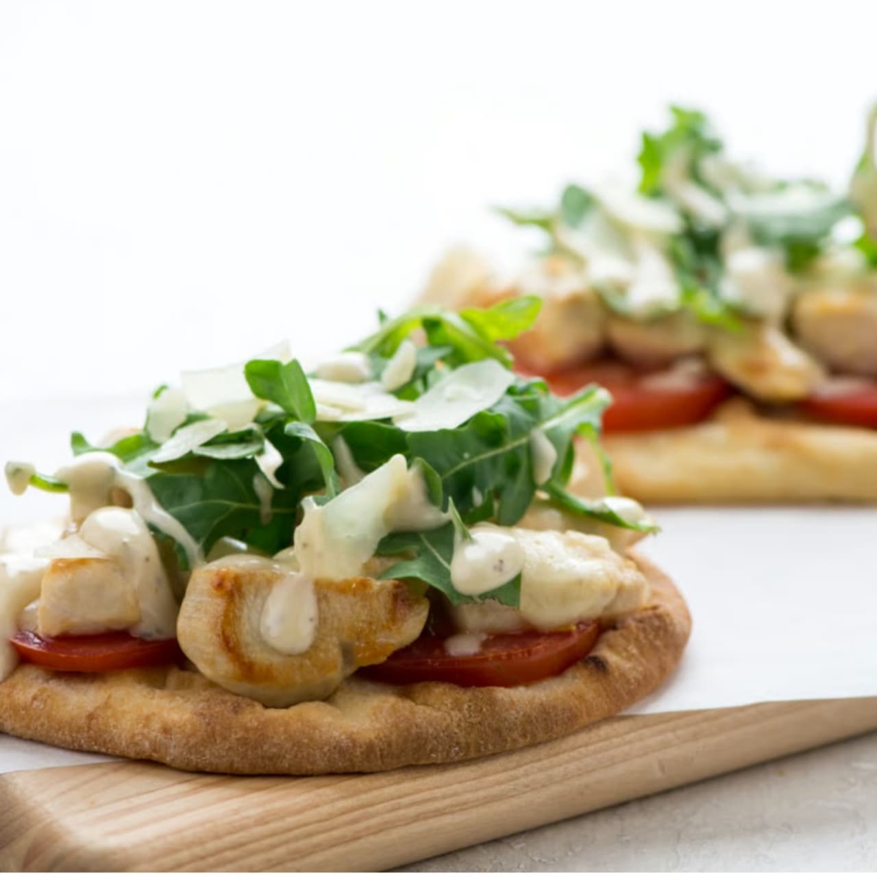 Chicken Caesar Mini Flatbreads with Shaved Parmesan