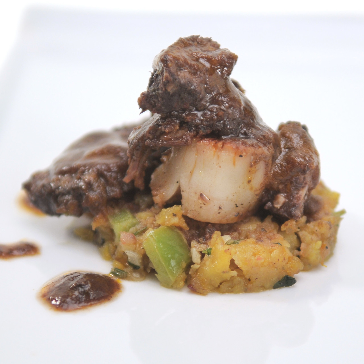 Braised Short Ribs with Seared Scallop on Mofongo Cake
