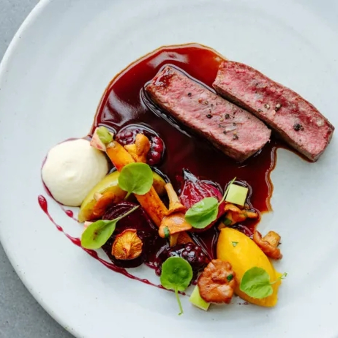 Venison with roasted root vegetables and a red wine sauce